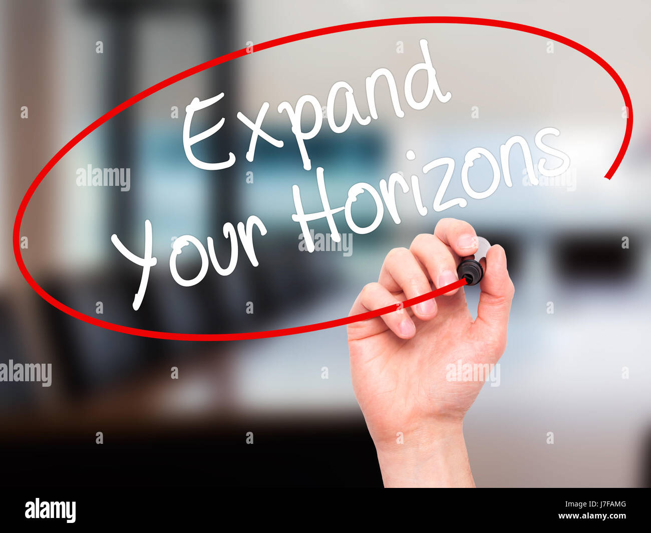 Man Hand writing Expand Your Horizons with black marker on visual ...