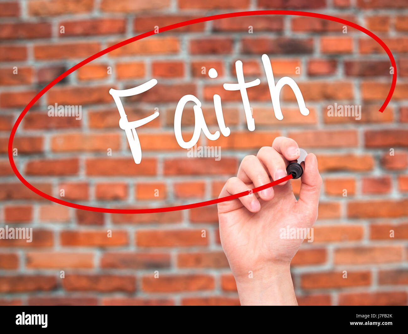 Man Hand writing Faith with black marker on visual screen. Isolated on ...