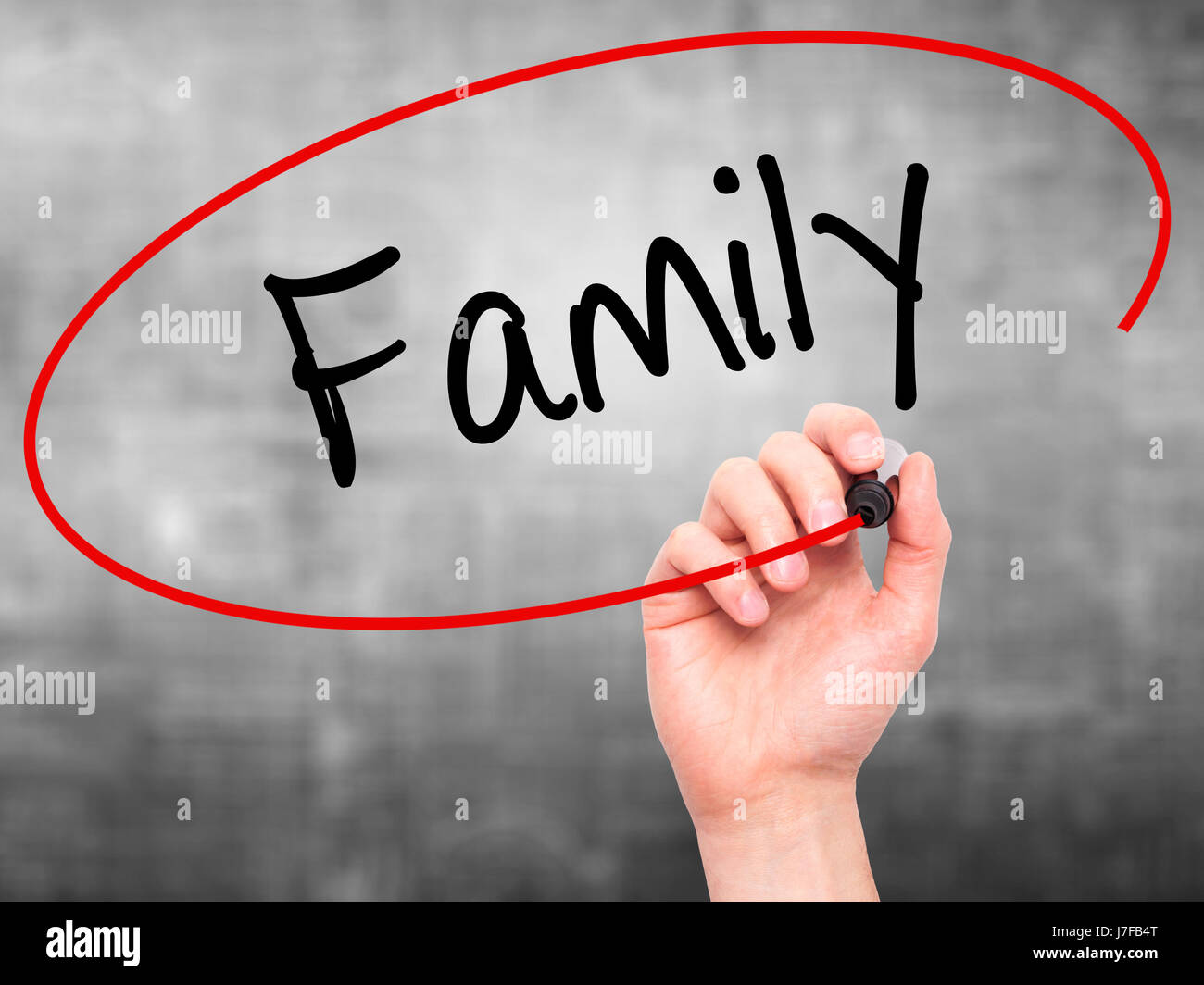 Man Hand writing Family with black marker on visual screen. Isolated on ...