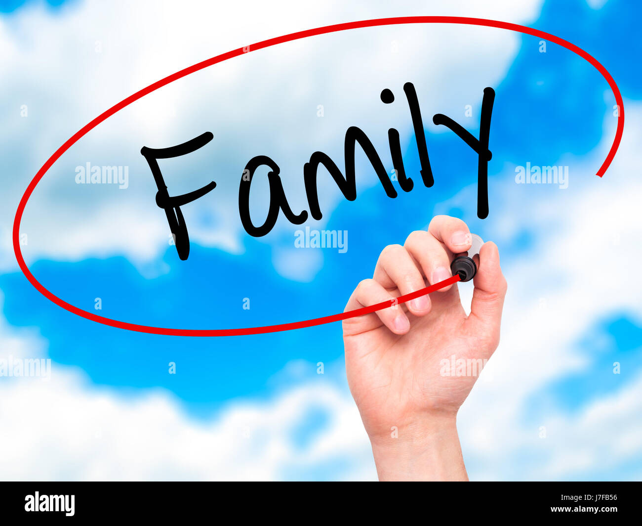 Man Hand writing Family with black marker on visual screen. Isolated on ...