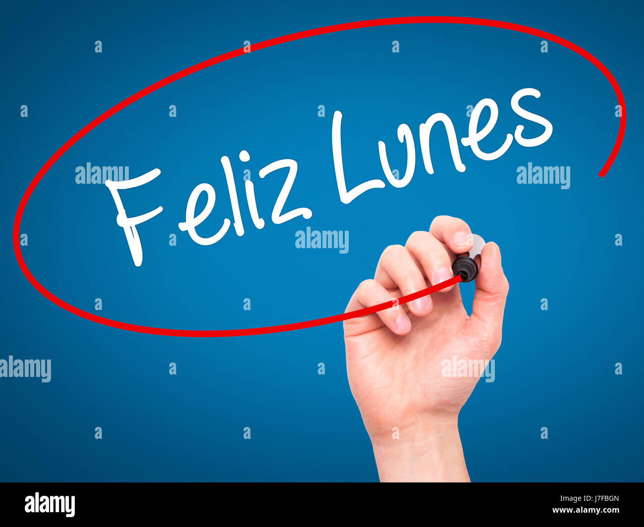 Man Hand writing Feliz Lunes (Happy Monday In Spanish) with black ...