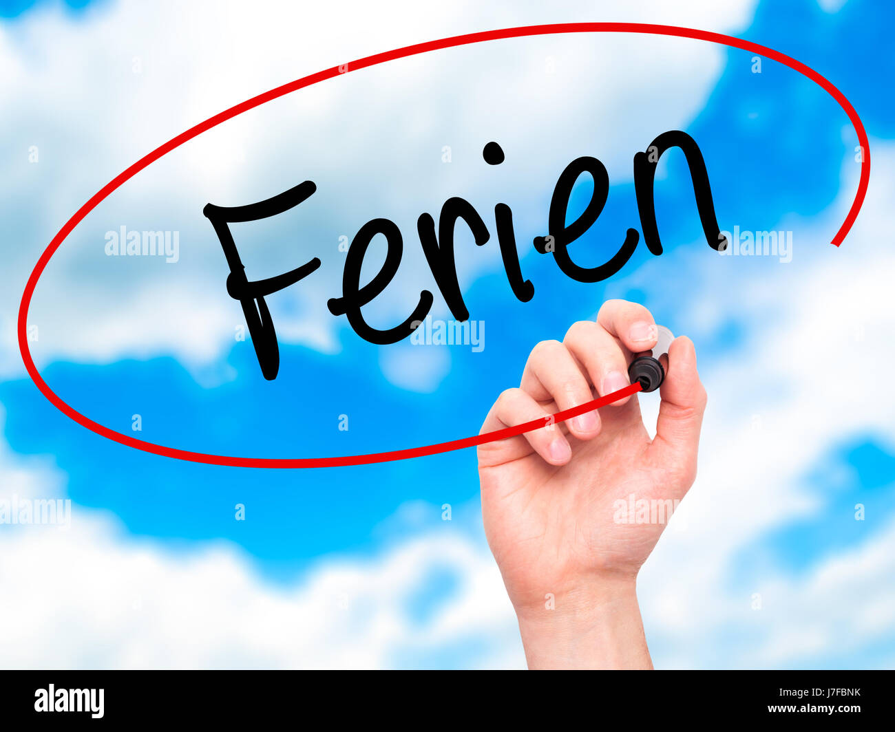 Man Hand writing Ferien (Vacation in German) with black marker on ...