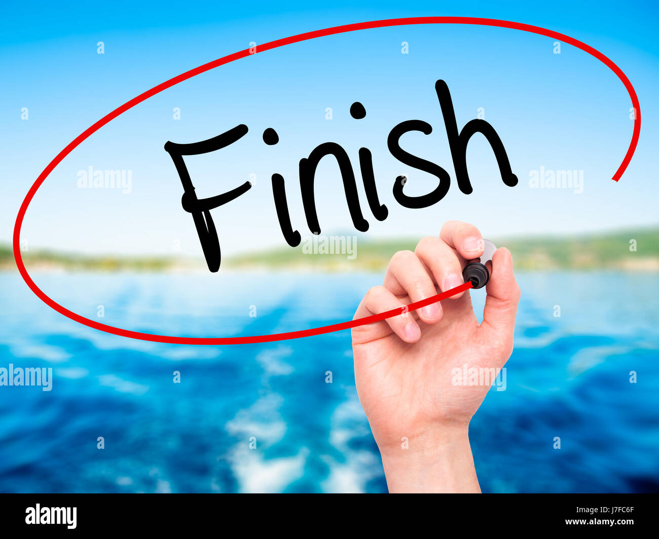 Man Hand writing Finish with black marker on visual screen. Isolated on ...