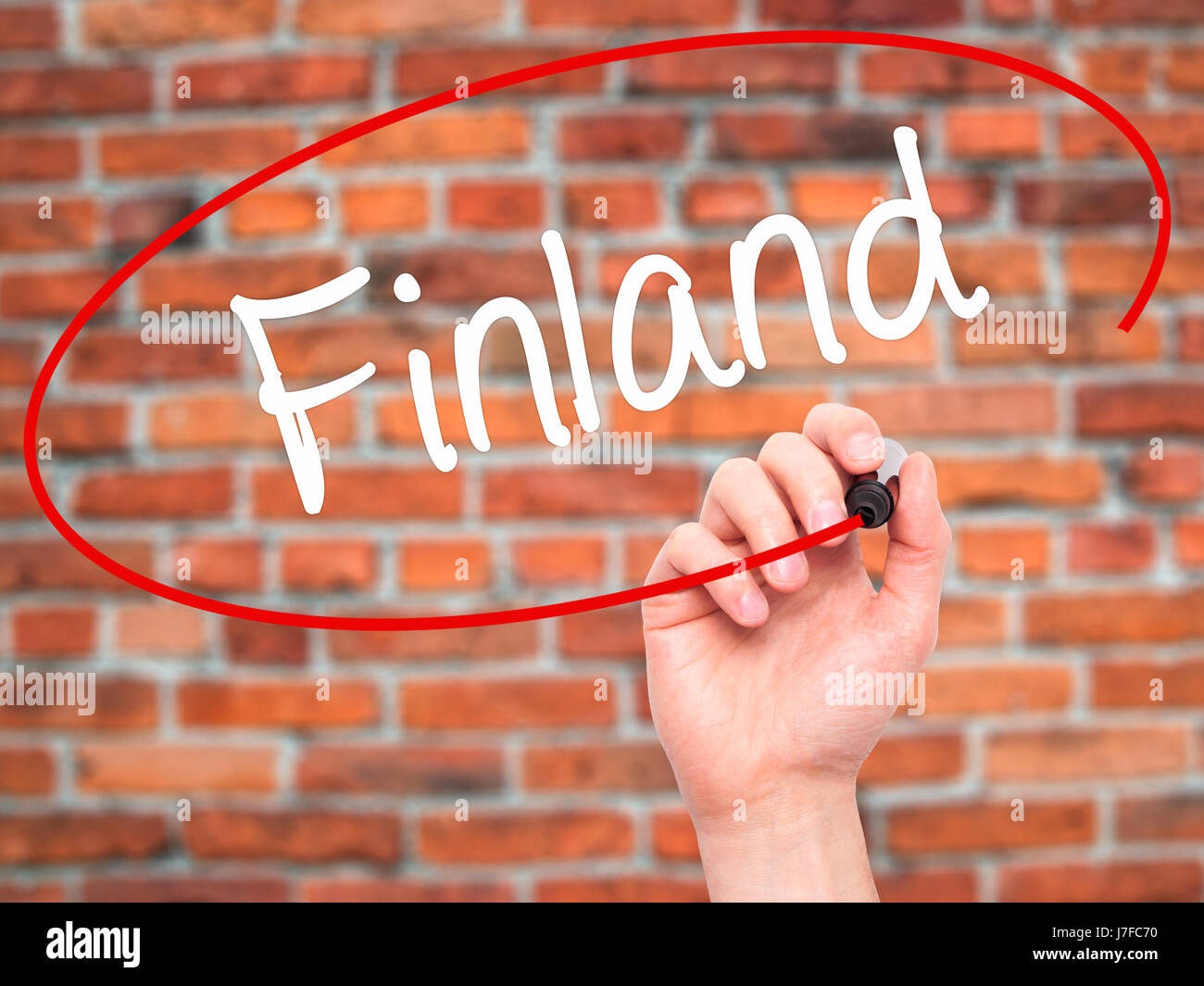 Man Hand writing Finland with black marker on visual screen. Isolated ...