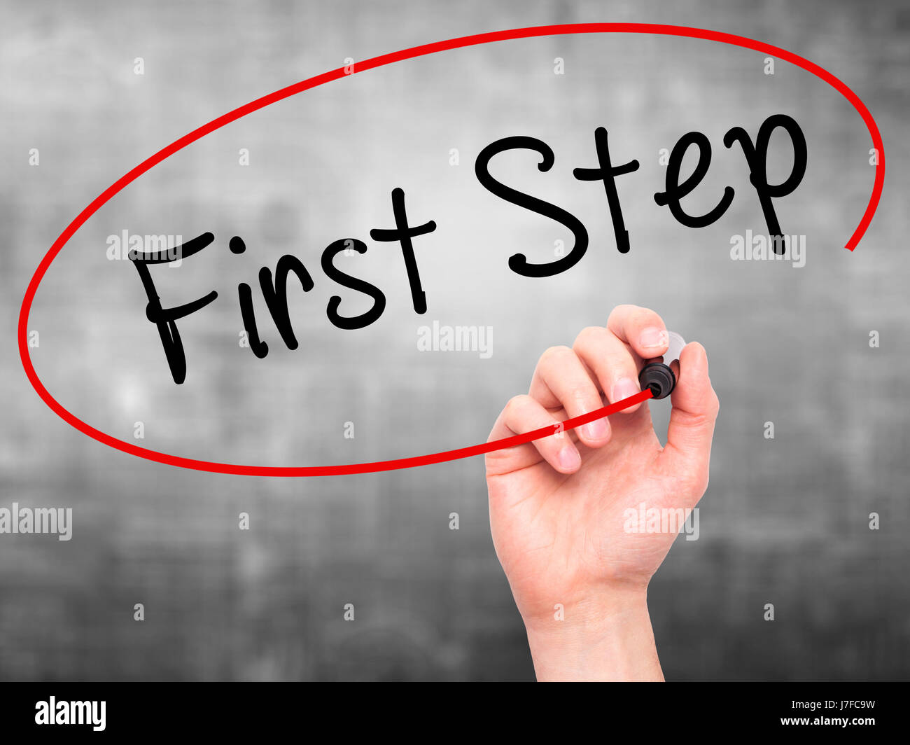 Man Hand writing First Step with black marker on visual screen ...