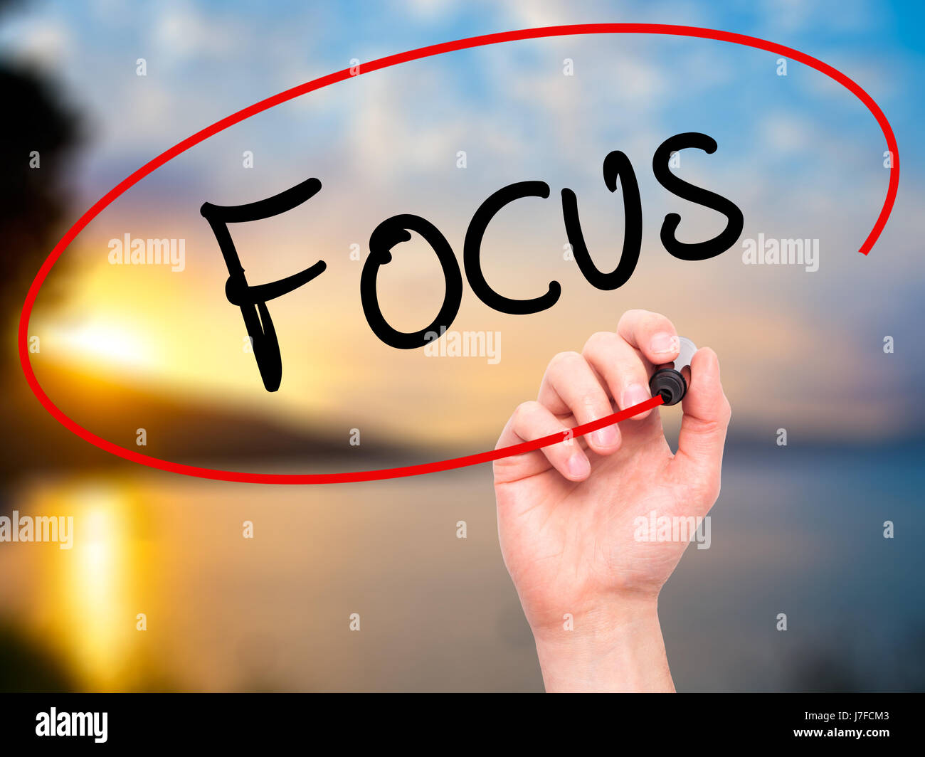 Man Hand writing Focus with black marker on visual screen. Isolated on ...