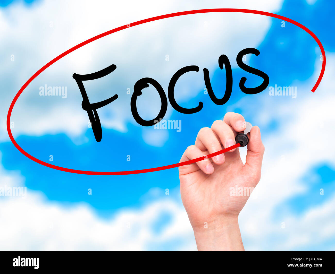 Man Hand writing Focus with black marker on visual screen. Isolated on ...