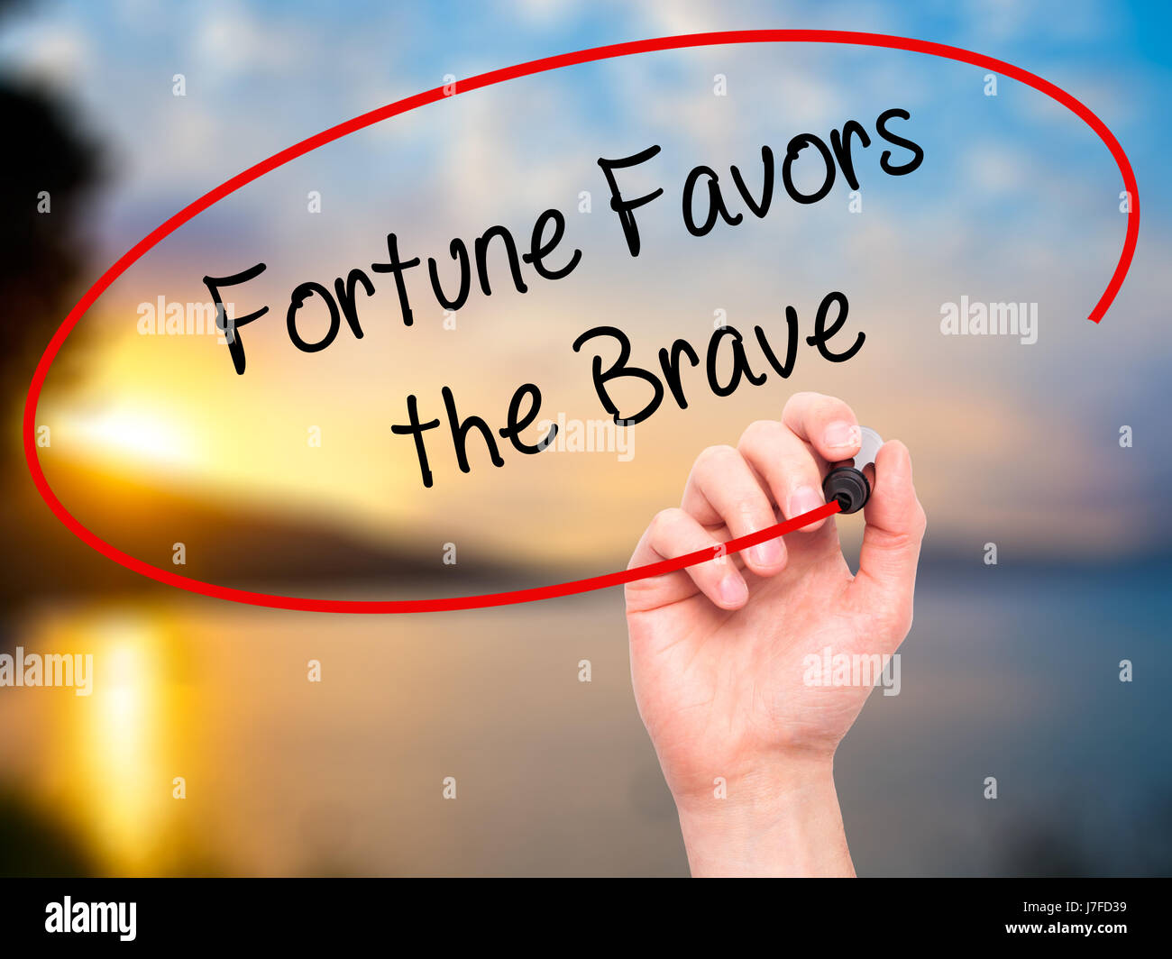 Man Hand writing Fortune Favors the Brave with black marker on visual ...