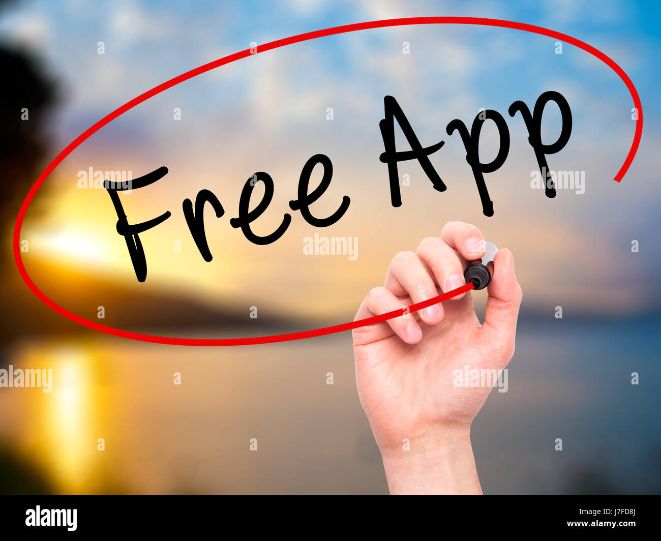 Man Hand writing Free App with black marker on visual screen. Isolated ...