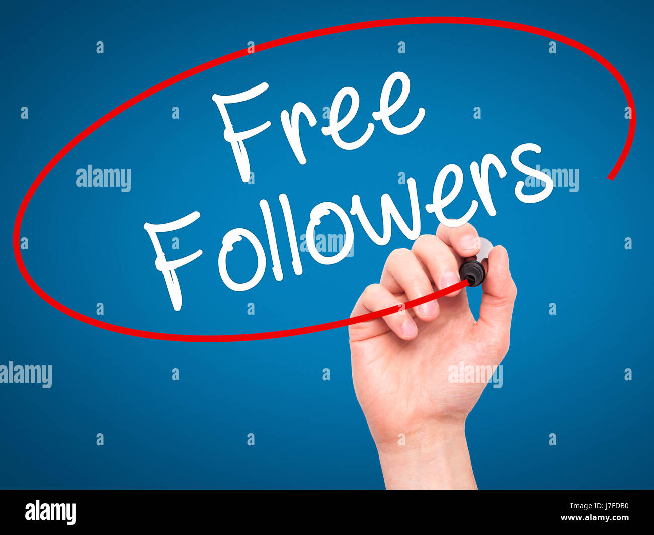 Man Hand writing Free Followers with black marker on visual screen ...