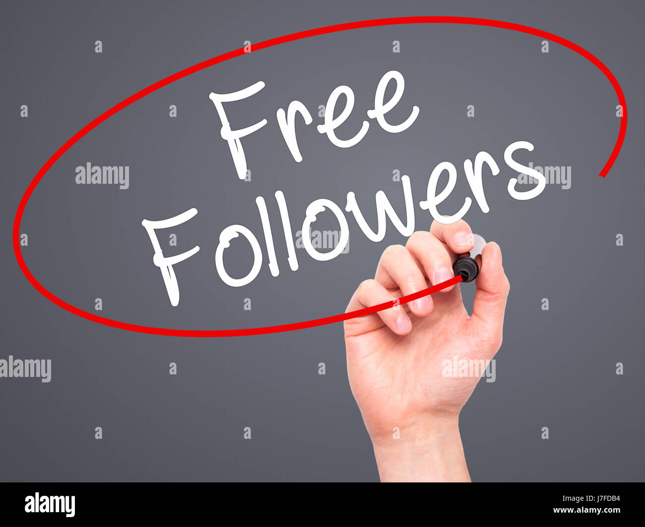 Man Hand writing Free Followers with black marker on visual screen ...