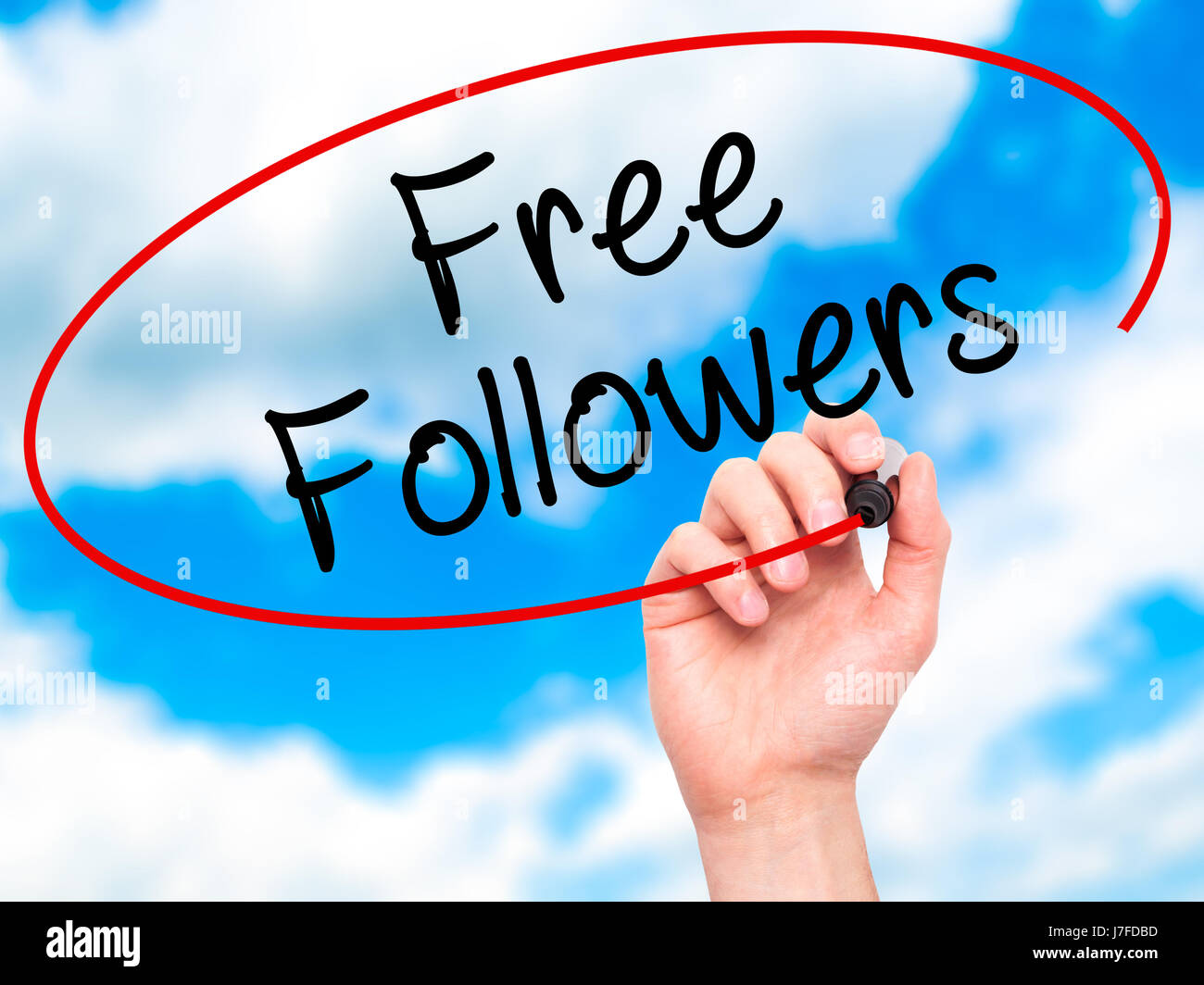 Man Hand writing Free Followers with black marker on visual screen ...