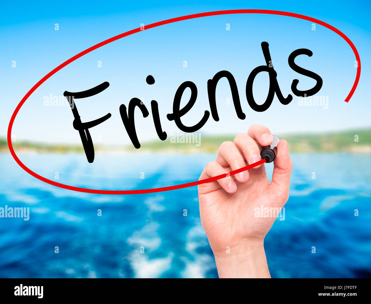 Man Hand writing Friends with black marker on visual screen. Isolated ...