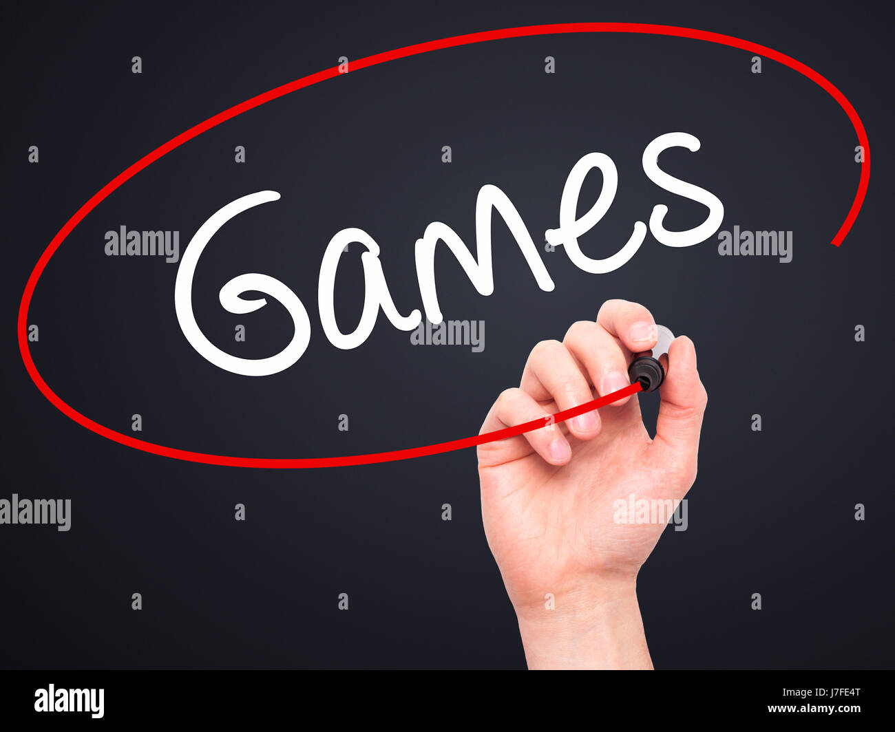Man Hand writing Games with black marker on visual screen. Isolated on ...