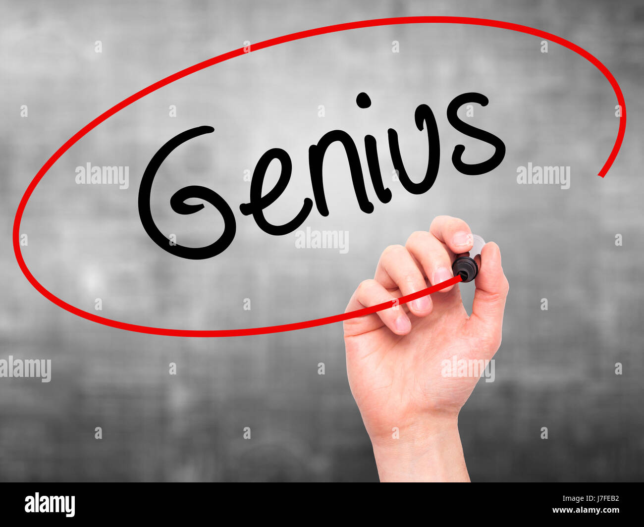 Man Hand writing Genius with black marker on visual screen. Isolated on ...