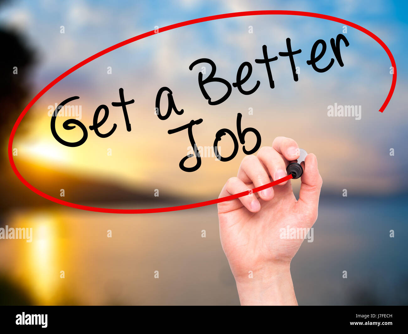 Man Hand writing Get a Better Job with black marker on visual screen ...