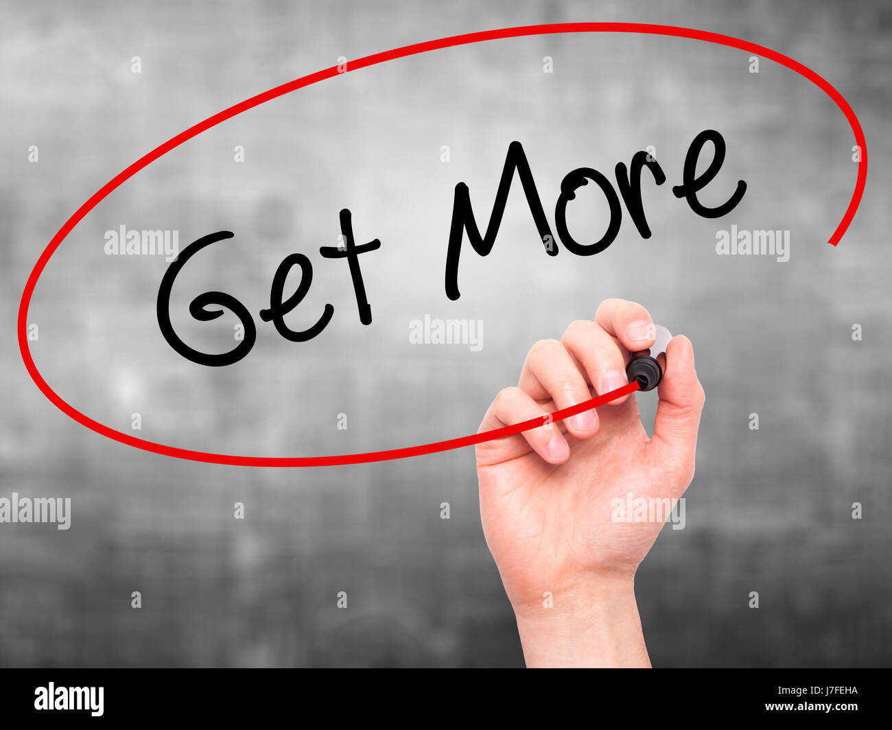 Man Hand writing Get More with black marker on visual screen. Isolated ...