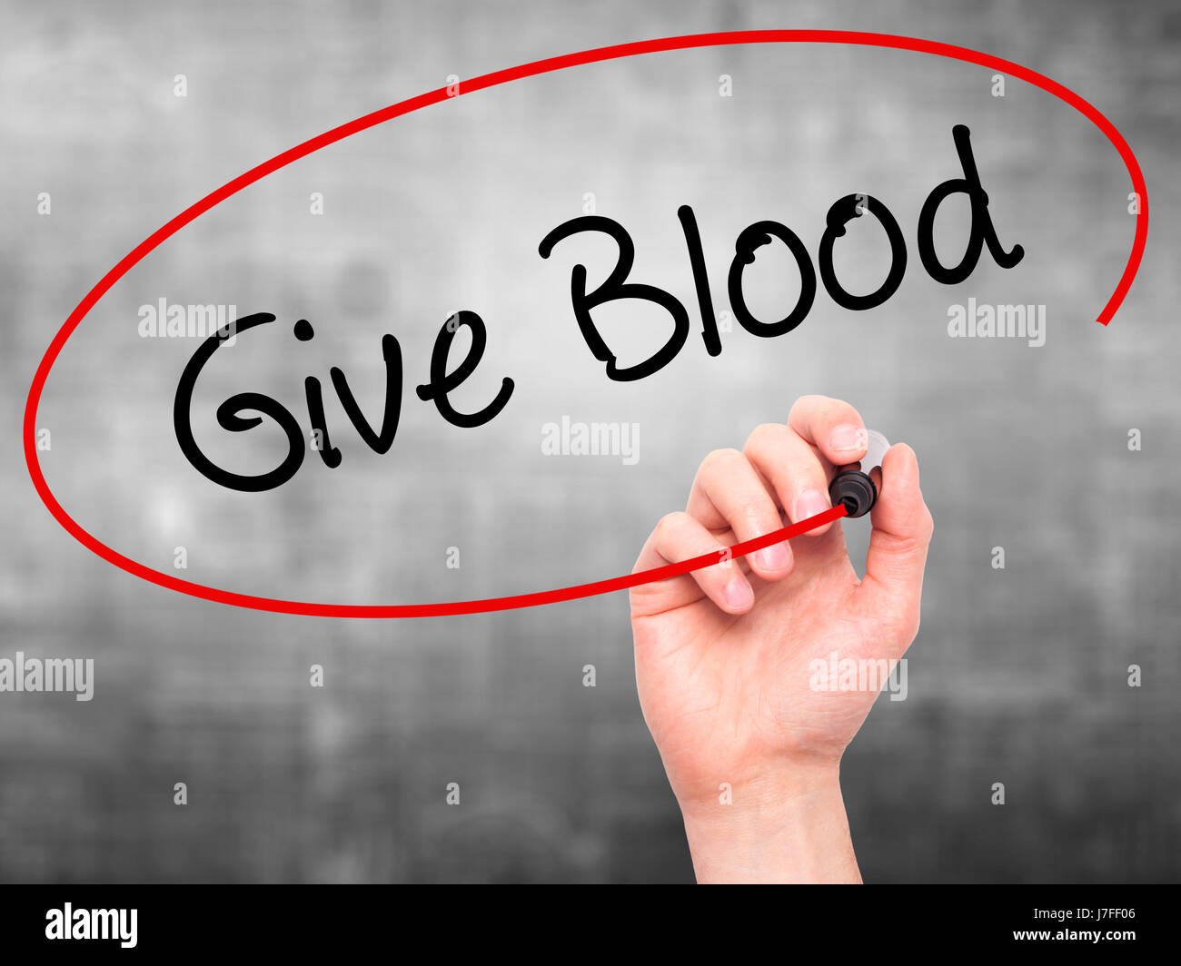 Man Hand writing Give Blood with black marker on visual screen ...