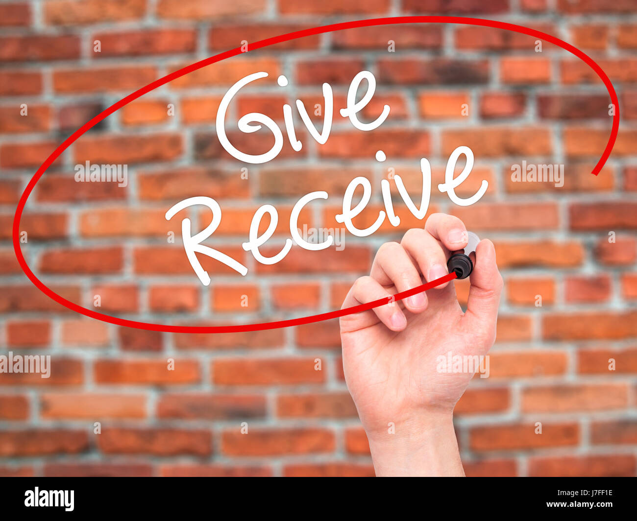 Man Hand writing Give Receive with black marker on visual screen ...