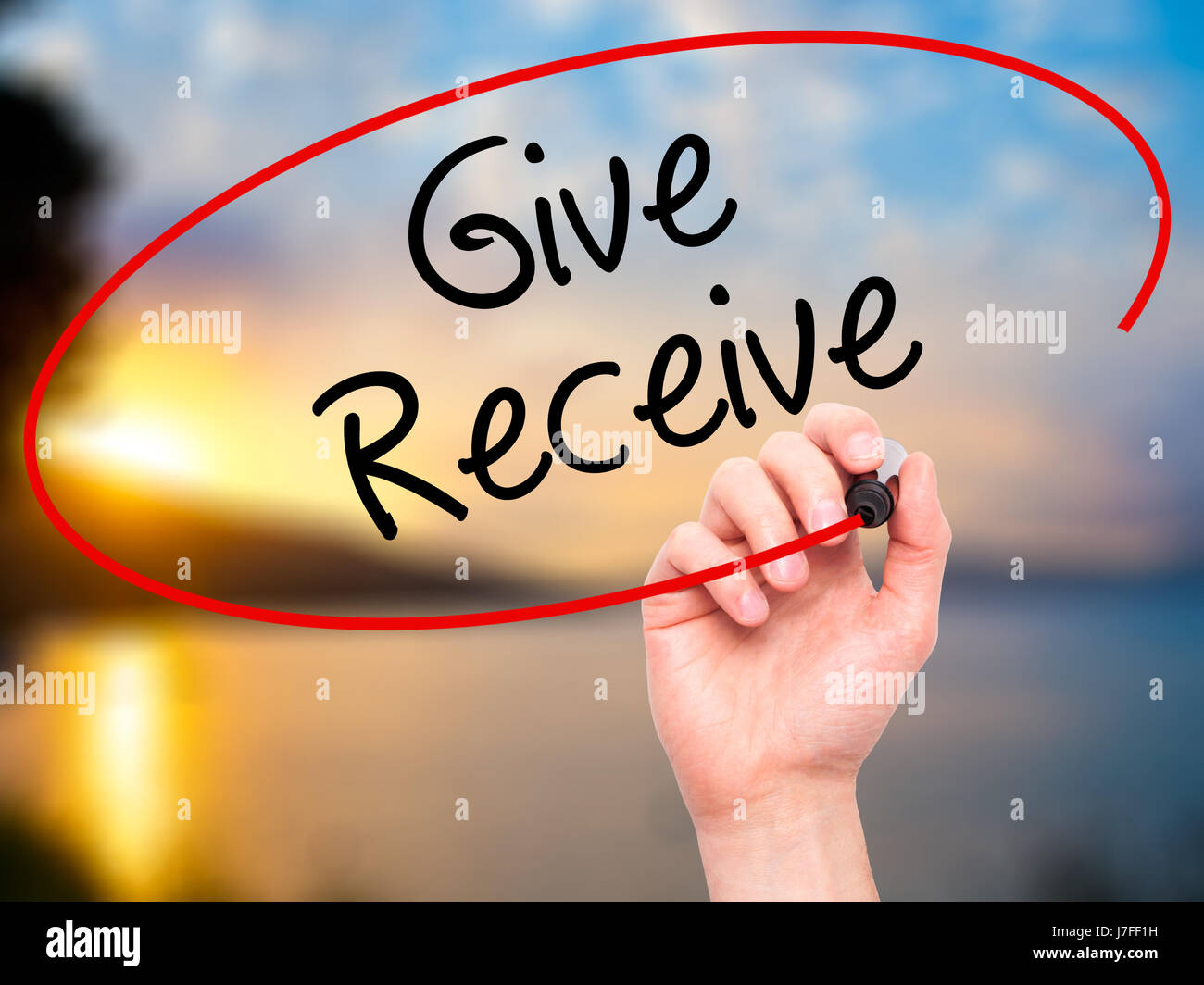 Man Hand writing Give Receive with black marker on visual screen ...