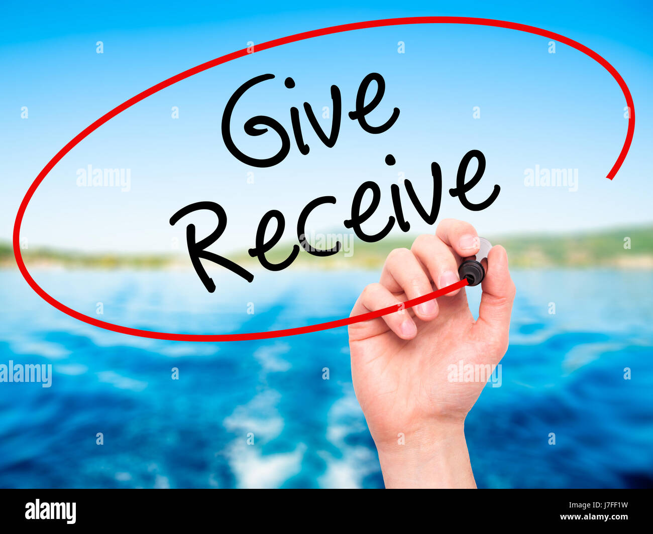 Man Hand writing Give Receive with black marker on visual screen ...