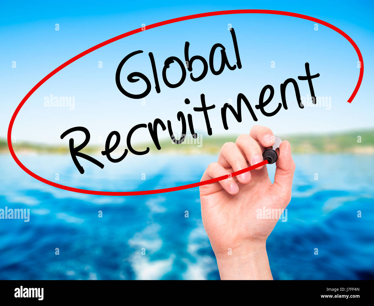 Man Hand writing Global Recruitment with black marker on visual screen ...