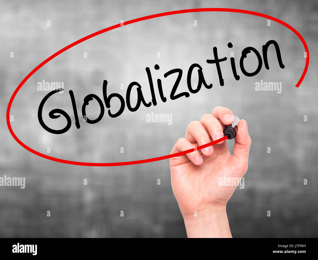 Man Hand writing Globalization with black marker on visual screen ...