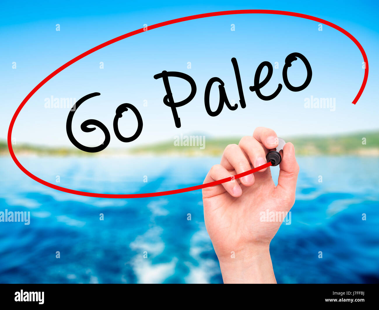 Man Hand writing Go Paleo with black marker on visual screen. Isolated ...