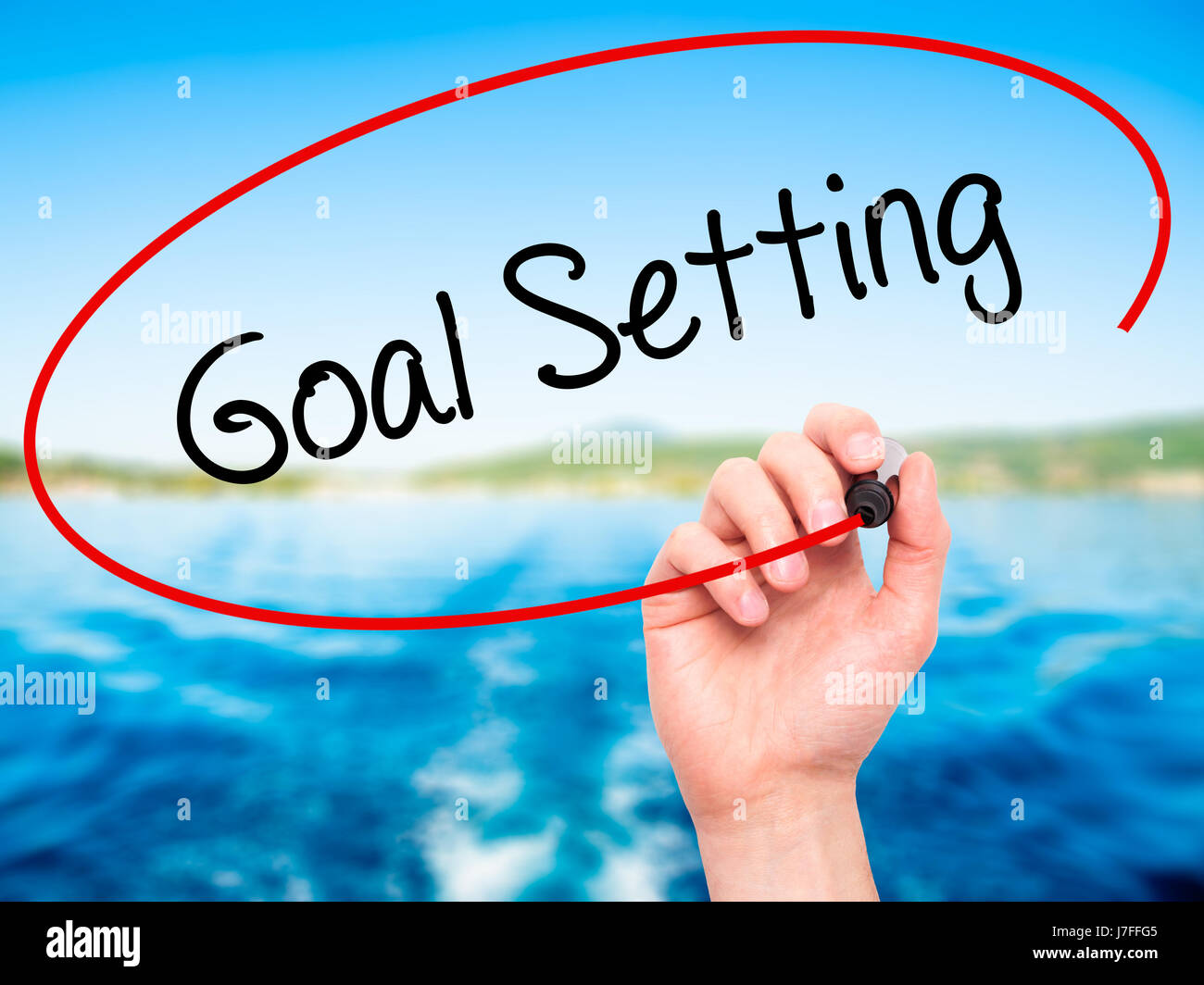 Man Hand writing Goal Setting with black marker on visual screen ...