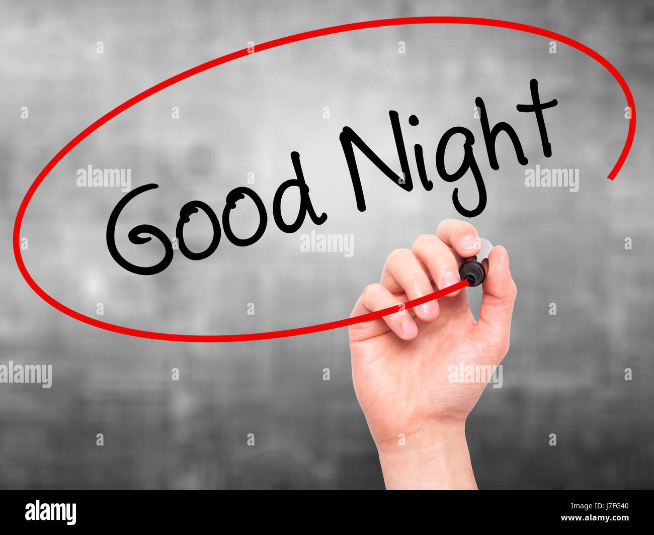 Man Hand writing Good Night with black marker on visual screen ...
