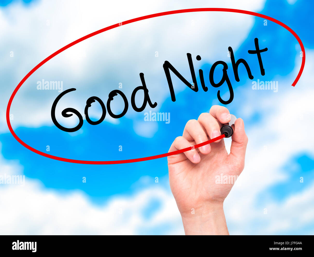 Man Hand writing Good Night with black marker on visual screen ...