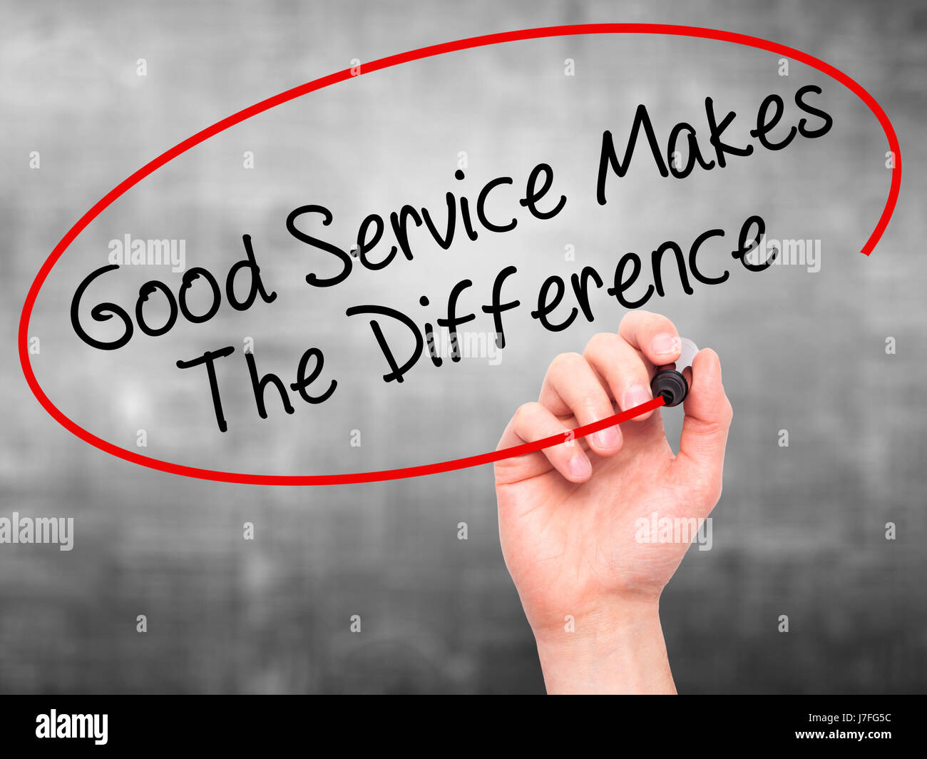 Man Hand writing Good Service Makes The Difference with black marker on ...