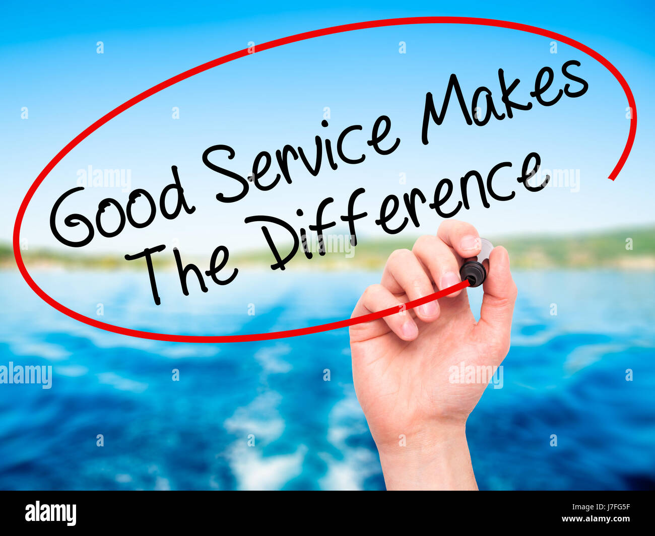 Man Hand writing Good Service Makes The Difference with black marker on ...