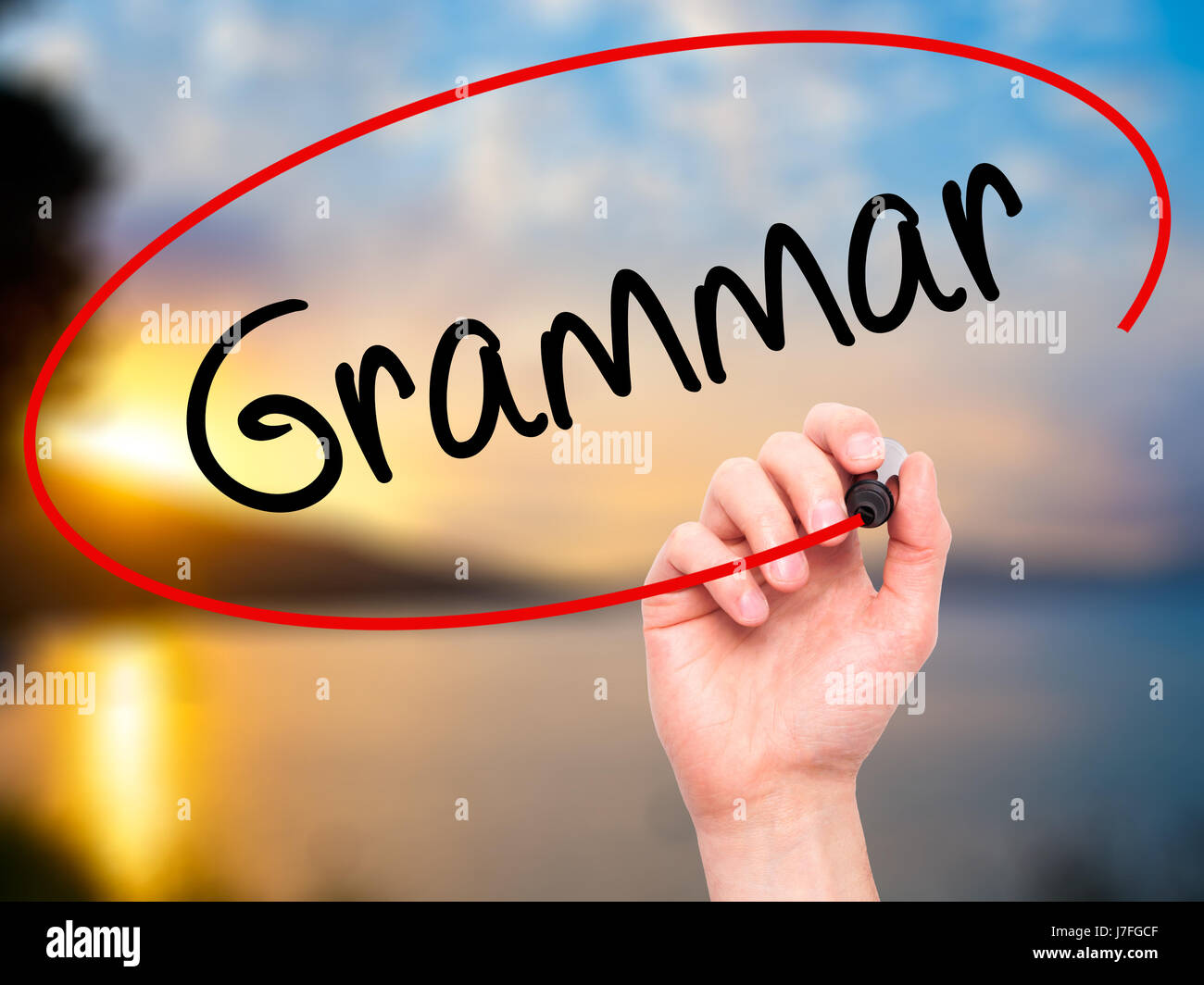 Man Hand writing Grammar with black marker on visual screen. Isolated ...