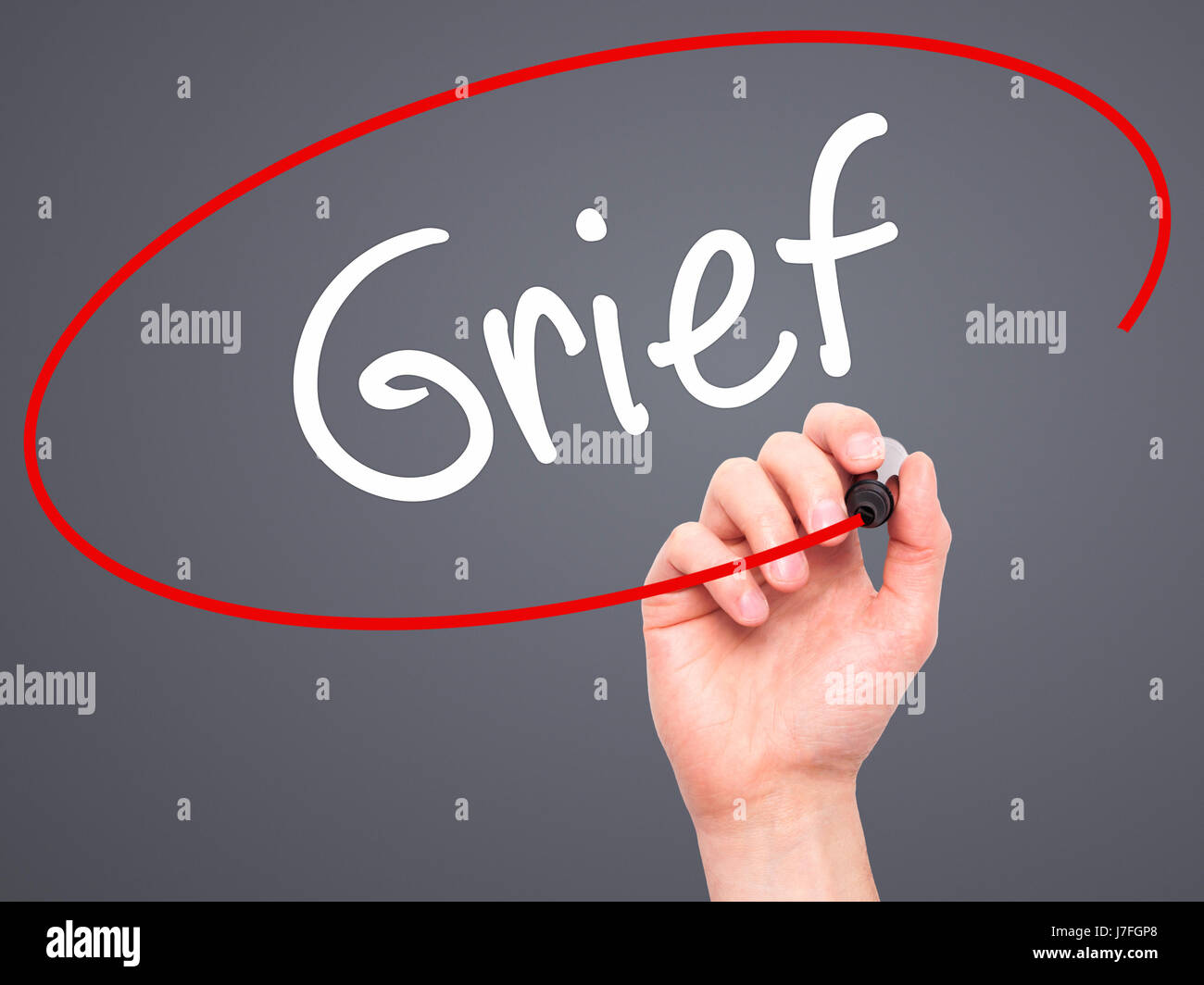 Man Hand writing Grief with black marker on visual screen. Isolated on ...