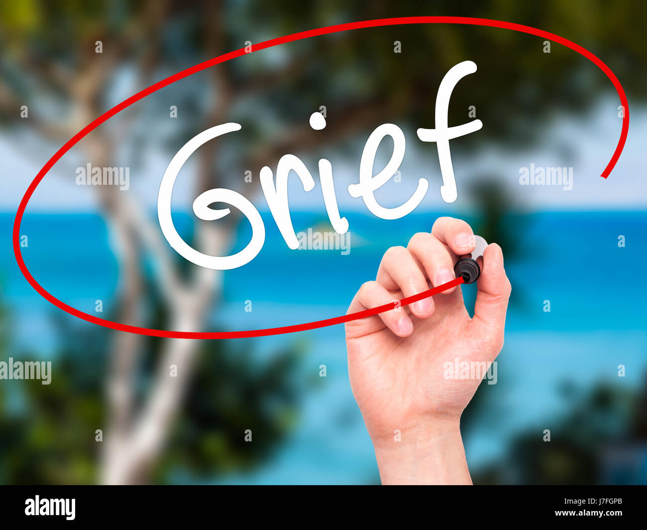 Man Hand writing Grief with black marker on visual screen. Isolated on ...