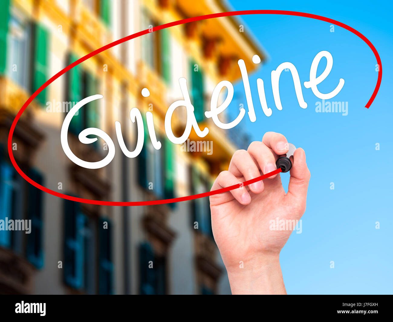 Man Hand writing Guideline with black marker on visual screen. Isolated ...