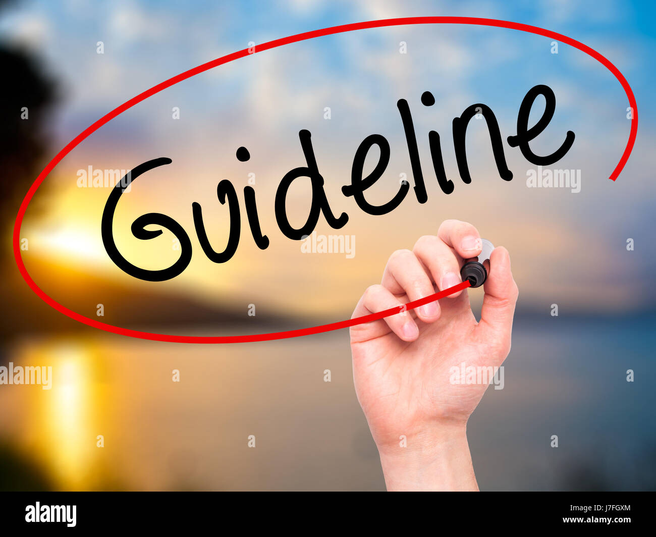 Man Hand writing Guideline with black marker on visual screen. Isolated ...