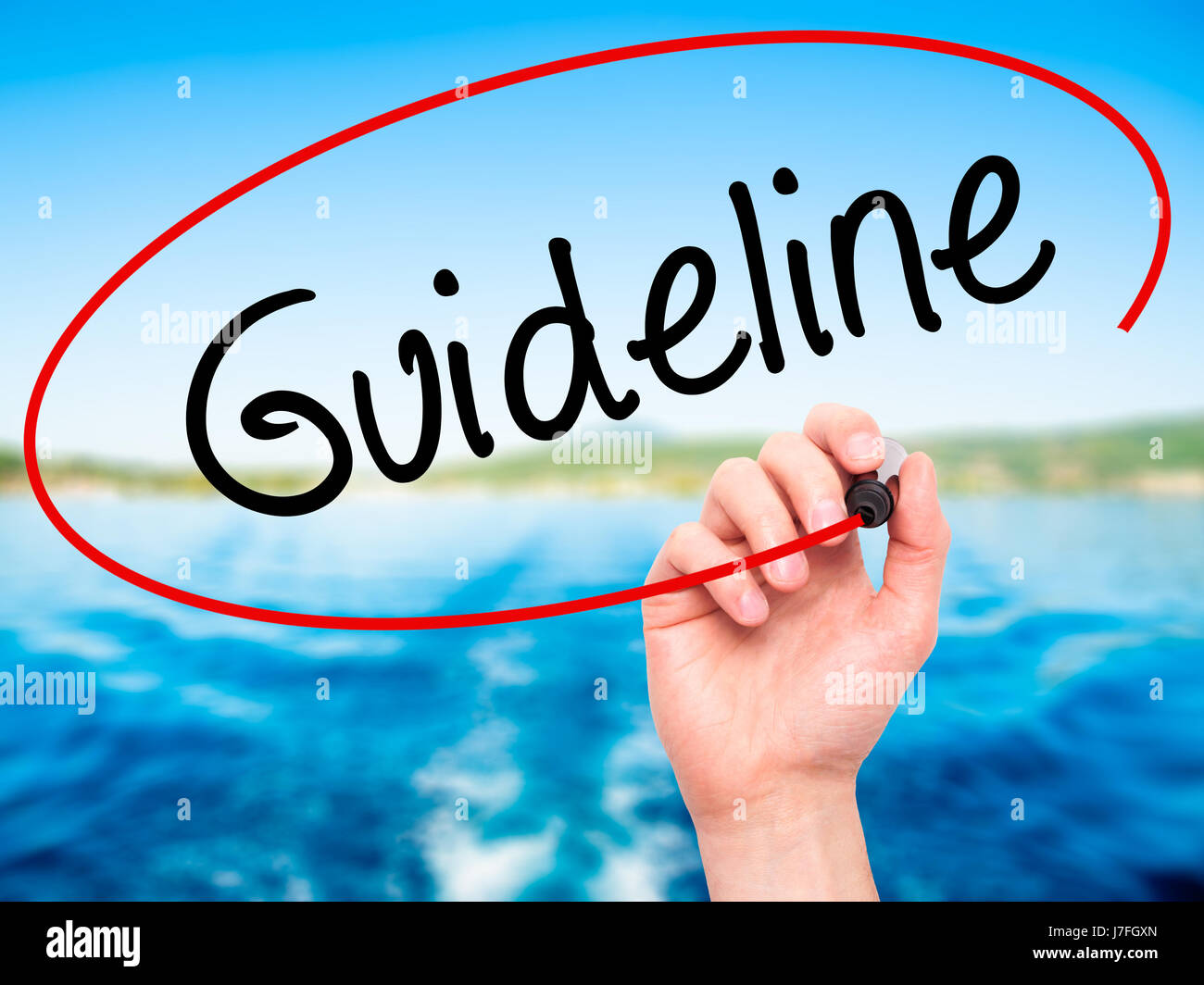 Man Hand writing Guideline with black marker on visual screen. Isolated ...