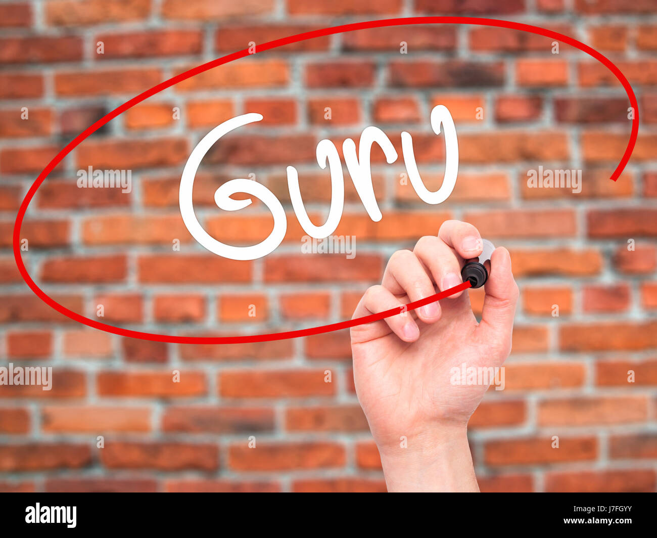 Man Hand writing Guru with black marker on visual screen. Isolated on ...