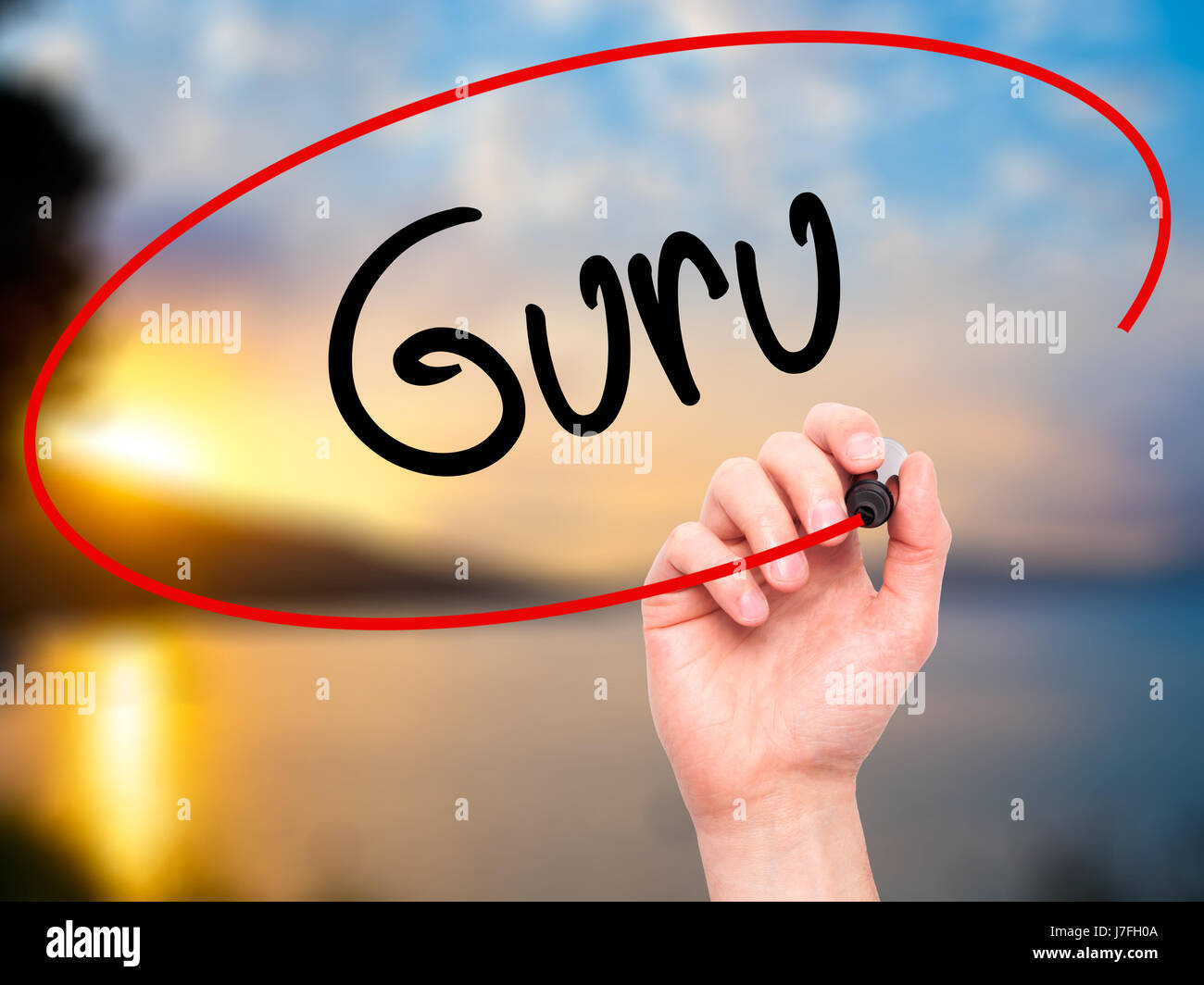 Man Hand writing Guru with black marker on visual screen. Isolated on ...