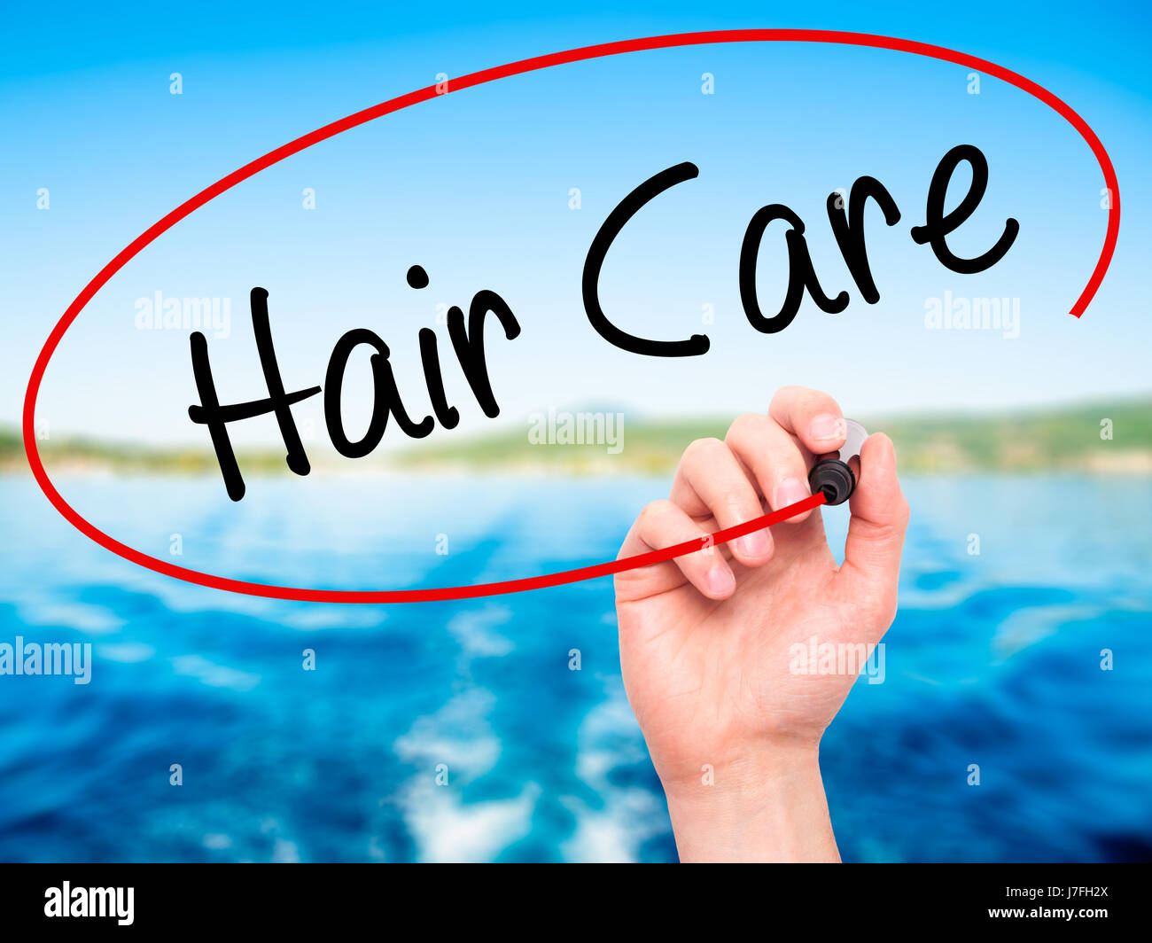 Man Hand writing Hair Care with black marker on visual screen. Isolated ...