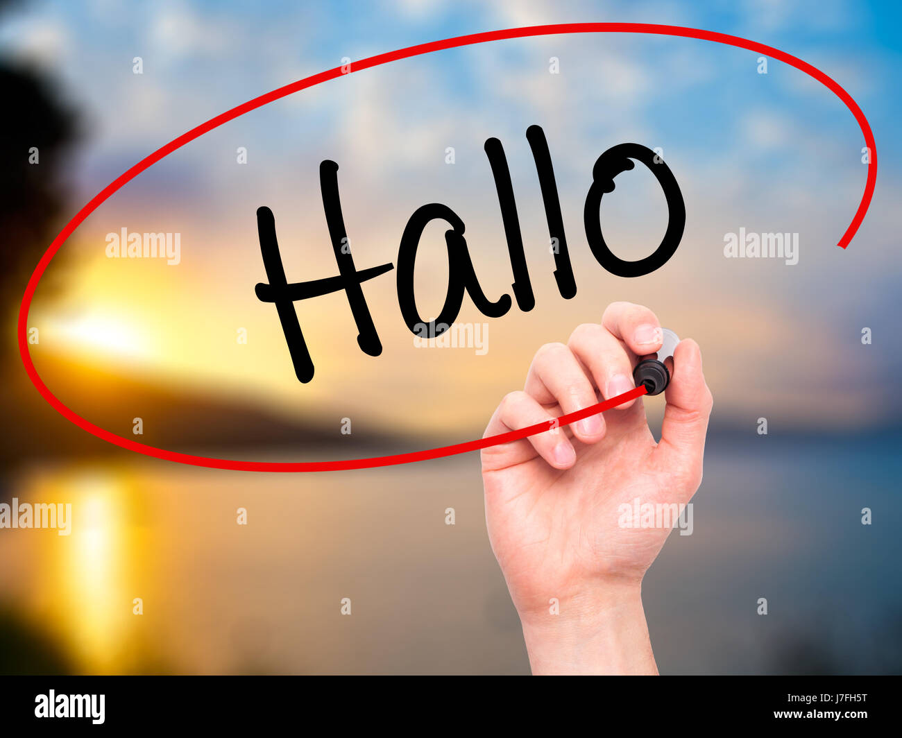 Man Hand writing Hallo (Hello in German) with black marker on visual ...