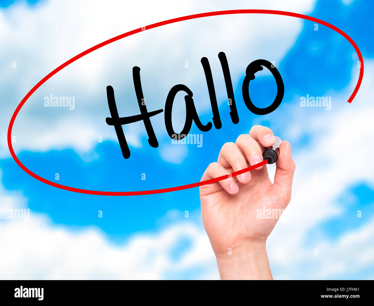 Man Hand writing Hallo (Hello in German) with black marker on visual ...