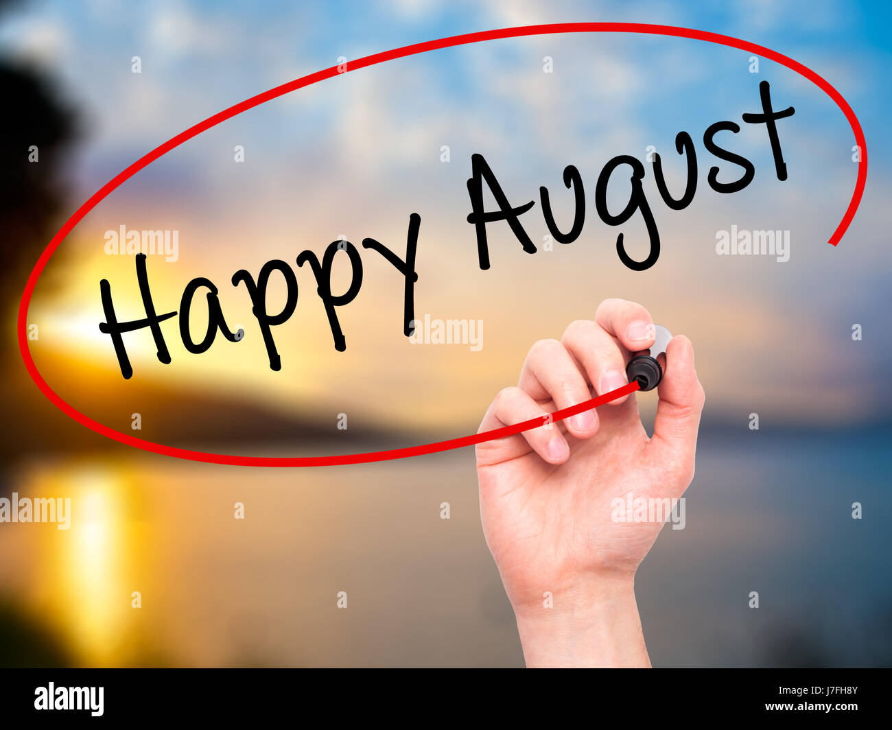 Man Hand writing Happy August with black marker on visual screen ...