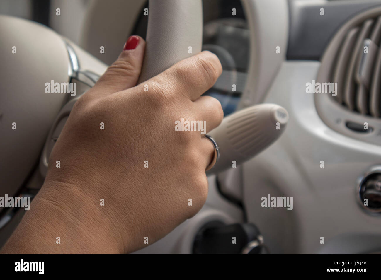 Woman's hand to drive Stock Photo - Alamy