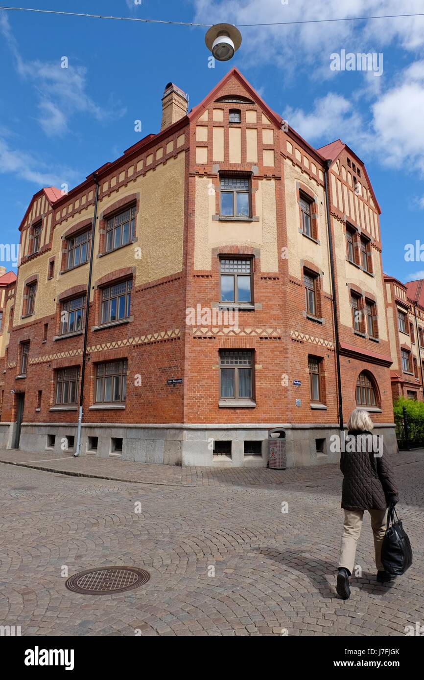 Gothenburg, Sweden - May, 2017: Brick building and a person walking on ...