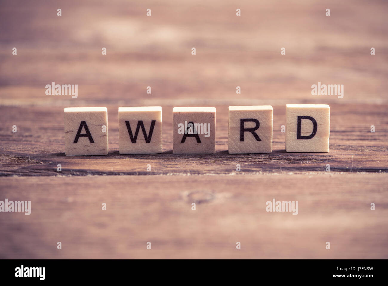 Award word of wooden elements with letter Stock Photo - Alamy