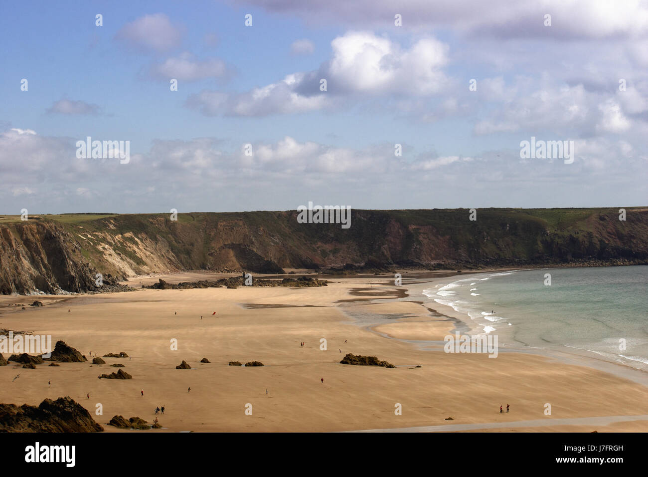 blue firmament sky salt water sea ocean water sands sand humans human ...