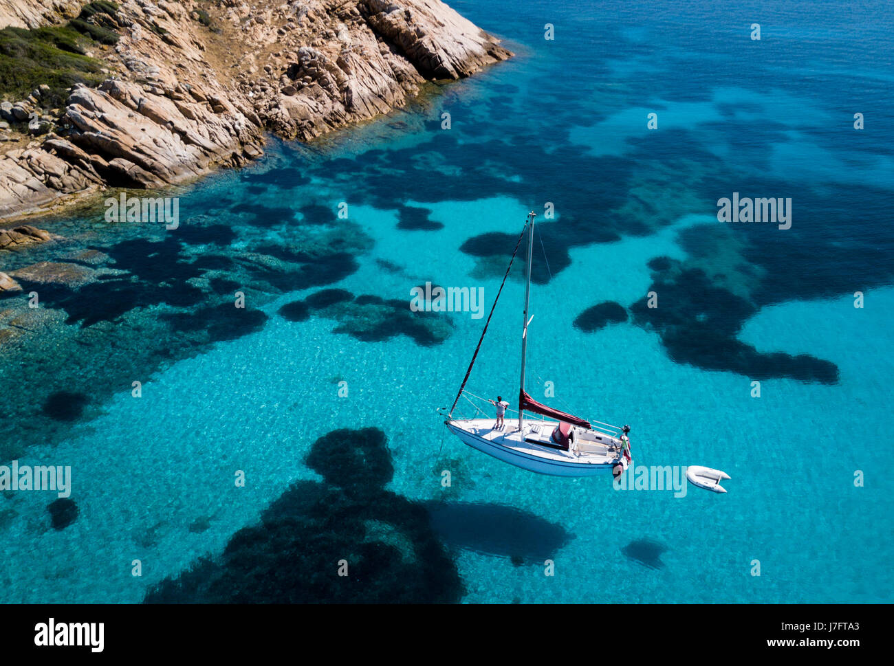 Aerial view of a boat in front of the Mortorio island in Sardinia ...